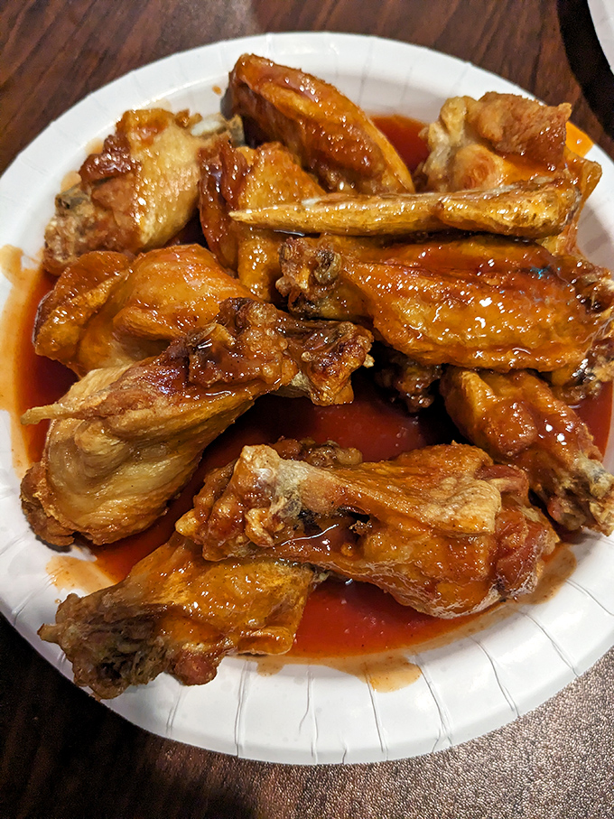 These wings aren't just cooked; they're transformed. The sauce-to-meat ratio achieves that perfect balance between crispy exterior and juicy interior&mdash;wing nirvana.