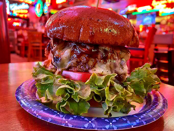 Behold the burger that ate Cincinnati! This juicy behemoth is so tall, it should come with its own climbing gear and a side of vertigo.