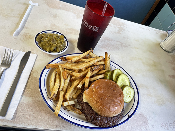 This isn't just a burger &ndash; it's a hand-held slice of happiness, complete with crispy fries and tangy pickles.