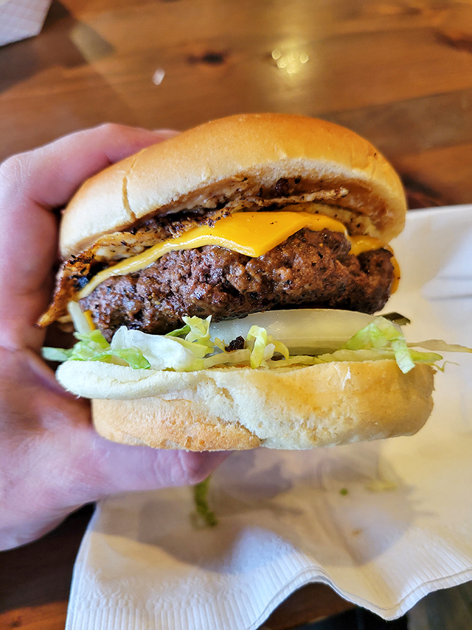 Meet the classic cheeseburger's cooler cousin. This beauty's got more layers than a Shakespeare play, and twice the drama in every bite.