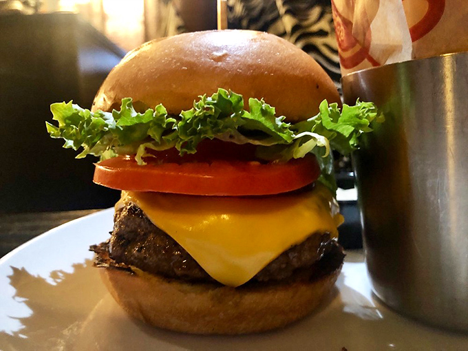 Behold the classic cheeseburger, elevated. This beauty could make even the Mona Lisa crack a smile.