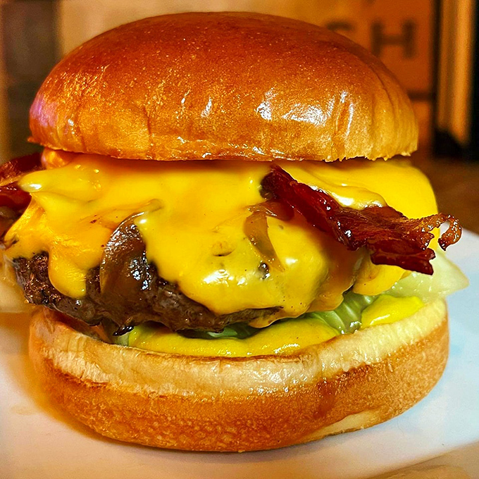 Is it a burger or a work of art? This cheese-draped masterpiece looks ready to star in its own Food Network special.