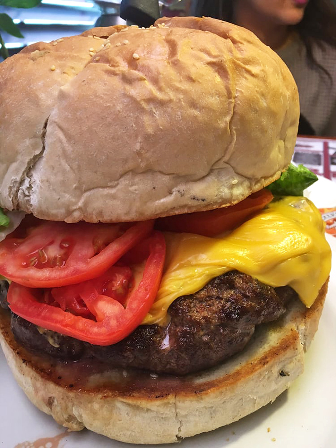 Holy cow, that's a burger! This towering masterpiece of beef and cheese is the Everest of sandwiches &ndash; are you up for the climb?