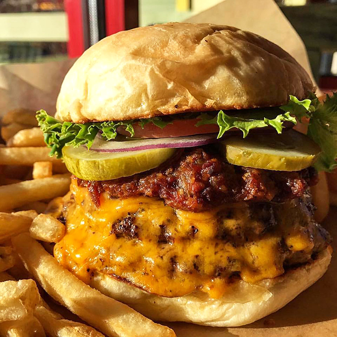 Behold, the burger of your dreams! This cheese-draped beauty could make a vegetarian weep with temptation.