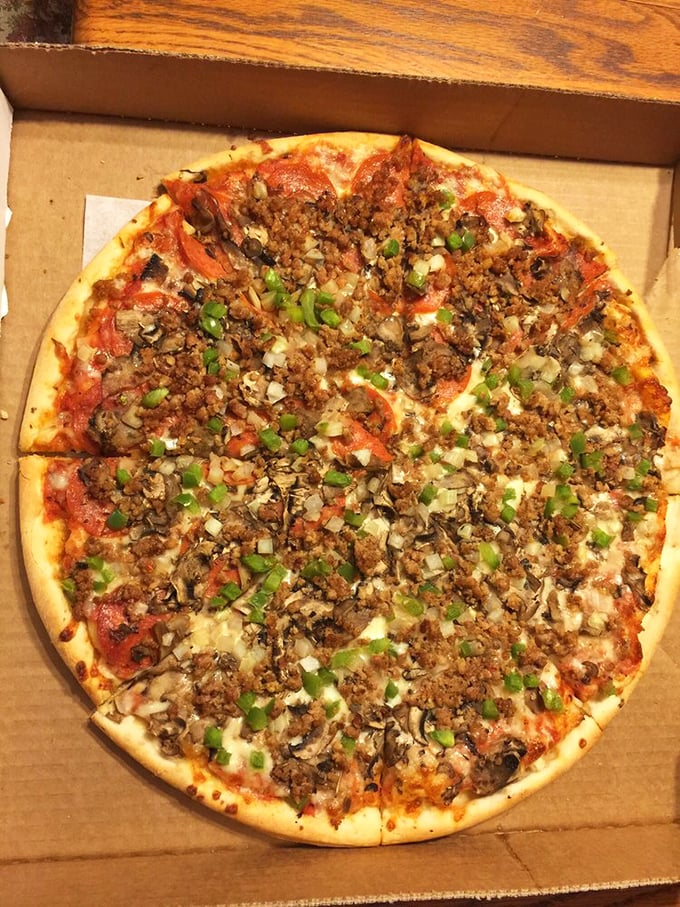 Holy moly, it's a flavor explosion! This pizza's got more toppings than a sundae bar at a kid's birthday party.