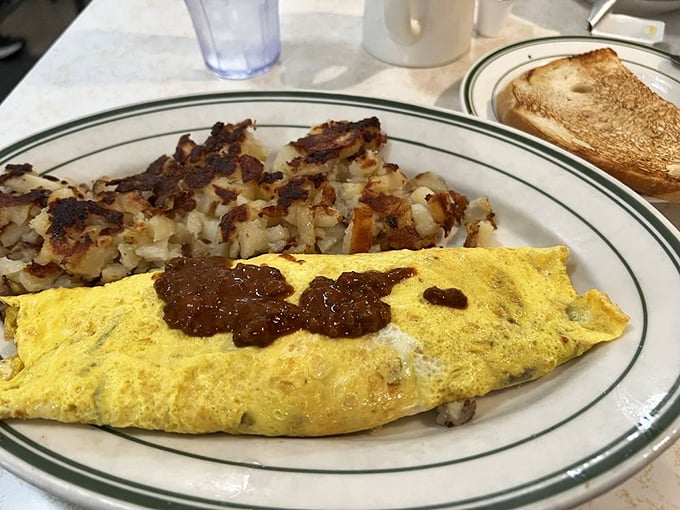 The omelet doesn't just contain chili&mdash;it embraces it like an old friend. Those crispy hash browns are the supporting actors who secretly steal the show.