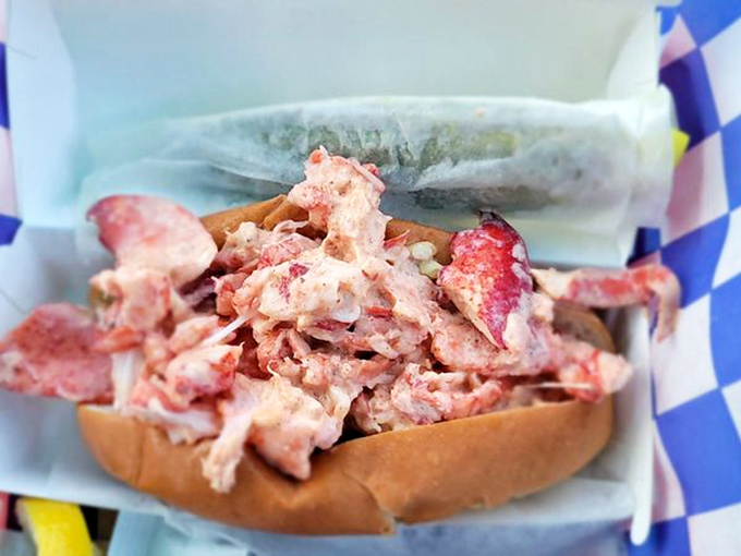 Lobster roll perfection! This beauty is packed with more meat than a bodybuilder's lunch box. Get ready for a flavor explosion in every bite.