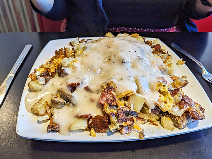Breakfast nirvana: potatoes smothered in country gravy that could make a vegetarian reconsider their life choices. This is what dreams are made of at 7am.