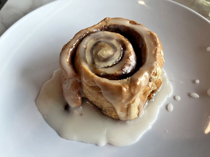 Holy cinnamon, Batman! This gooey masterpiece isn't just a roll, it's a warm hug for your mouth.