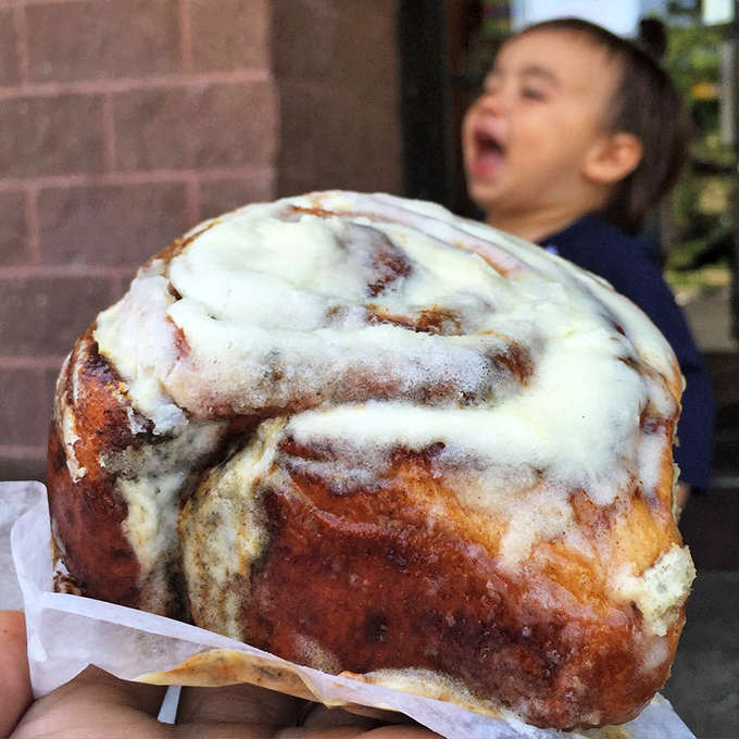 Holy cinnamon, Batman! This isn't just a roll, it's a pillow of pure bliss that could make even the Joker smile.