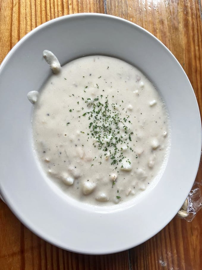 Behold, the holy grail of comfort food! This clam chowder looks so creamy and inviting, it could make Neptune himself trade his trident for a spoon.