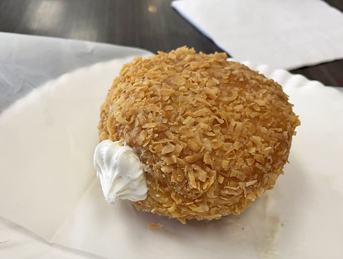 This coconut cream donut isn't just a treat, it's a tropical vacation for your taste buds.