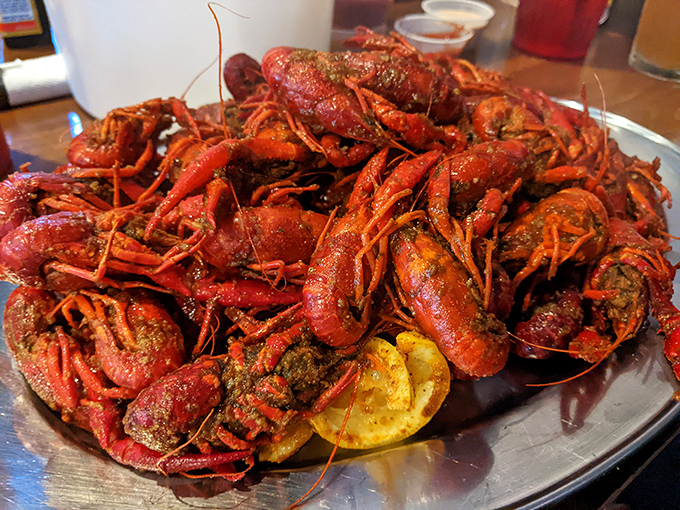 Holy crawfish, Batman! This mountain of spicy, succulent crustaceans is what seafood lovers' dreams are made of. Grab a bib and dive in!