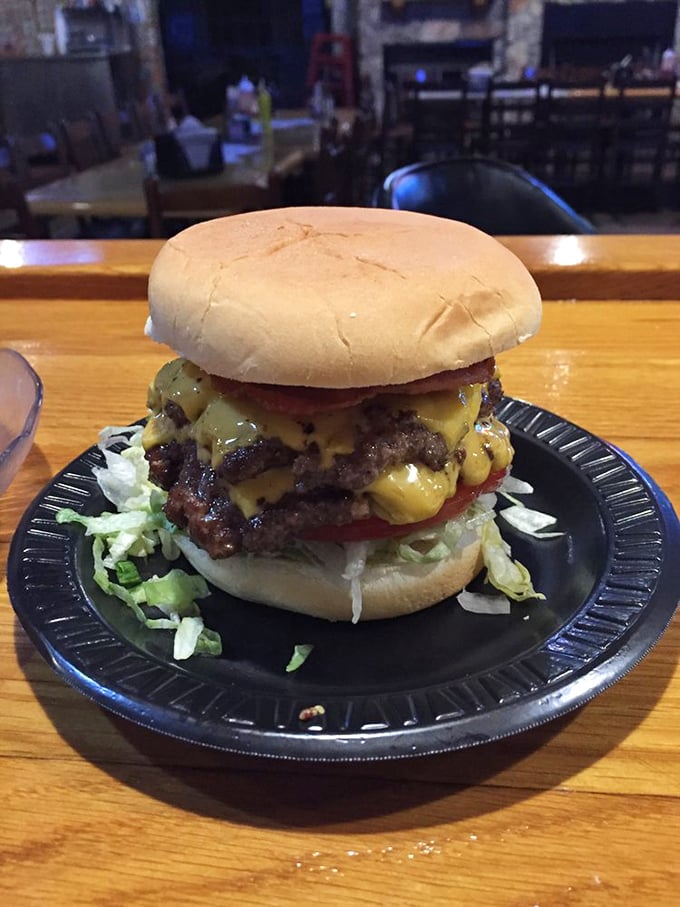 Holy moly, would you look at that burger! It's not just a meal, it's a delicious skyscraper of beefy goodness.