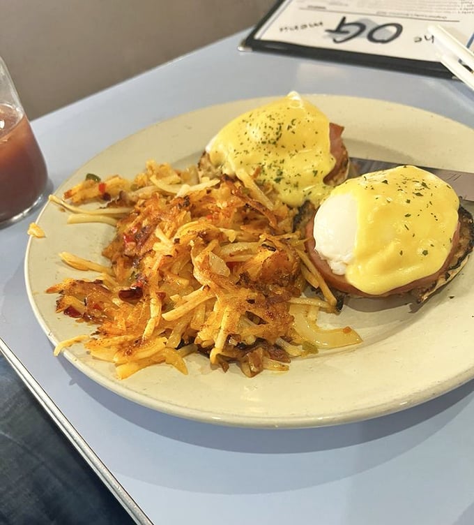 Eggs Benedict, the breakfast of champions! These golden orbs of delight perch atop their English muffin thrones, ready to rule your taste buds.