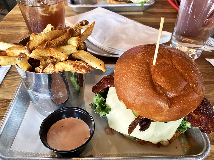 Behold, the FTC Burger! This towering masterpiece of meat and cheese is what food dreams are made of.