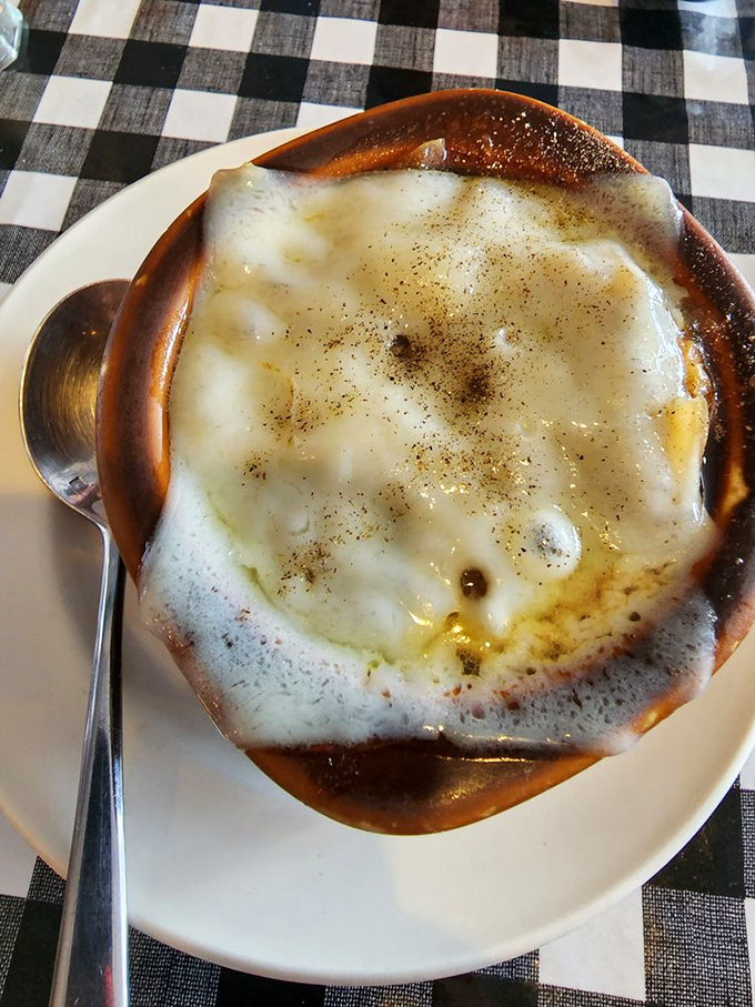 Behold, the French onion soup that launched a thousand sighs. It's not just a meal, it's a warm, cheesy hug for your taste buds.