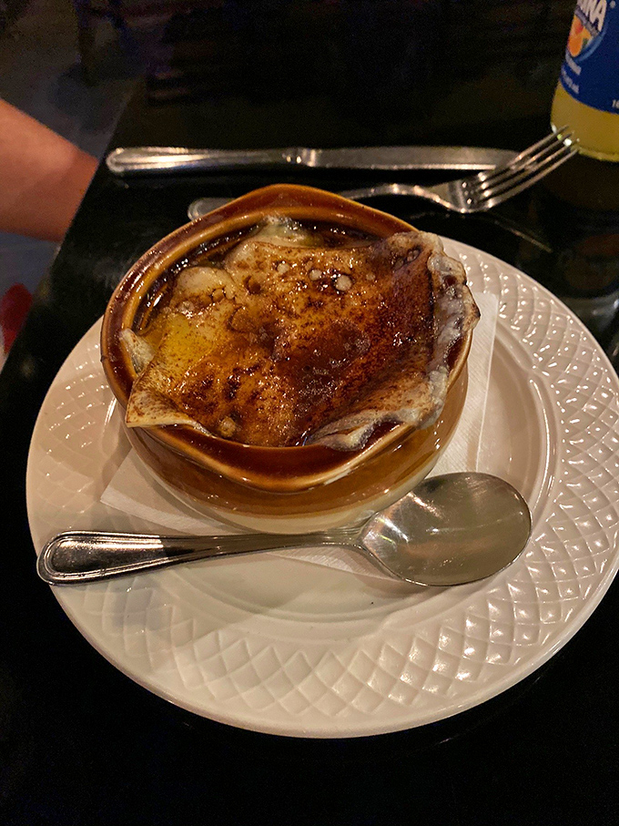 Behold, the crown jewel of comfort food! This French onion soup could make even the Mona Lisa crack a smile.