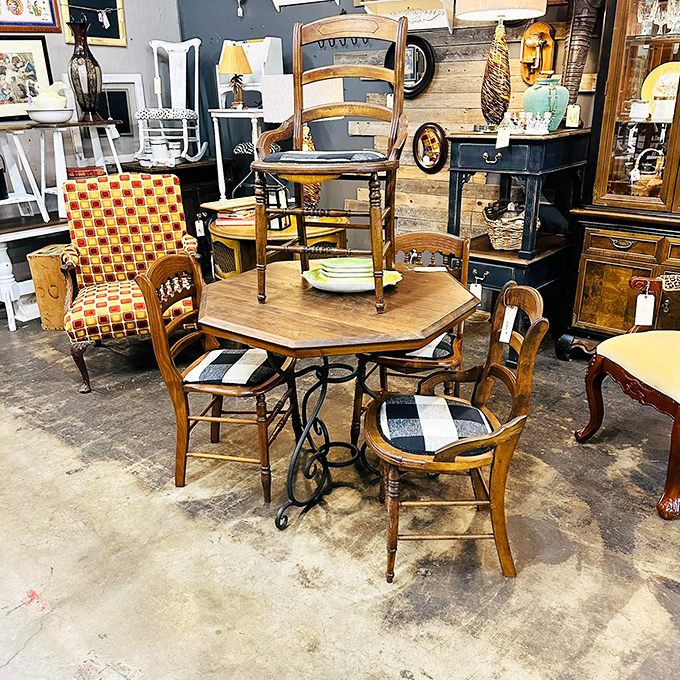 Pull up a chair... or ten! This eclectic furniture display is a mismatched masterpiece, perfect for those who think "matching set" is just another way to say "boring."