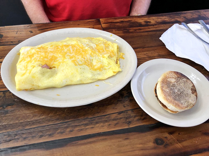 The Incredible Bulk: This ham and cheese omelet is so stuffed, it's practically doing bicep curls on the plate.