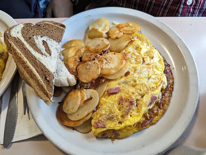 This ham and cheese omelet is so fluffy, it could double as a pillow. But trust me, you'll want to eat it, not sleep on it.