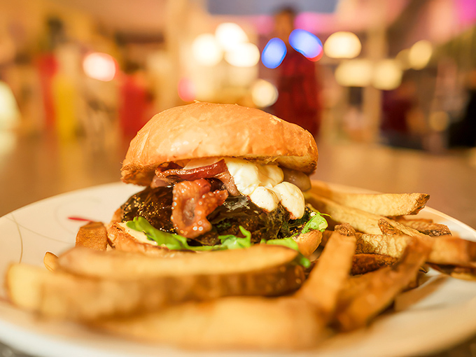 Holy huckleberry, Batman! This award-winning burger is a flavor superhero, with goat cheese and bacon joining forces to save your taste buds from boredom.