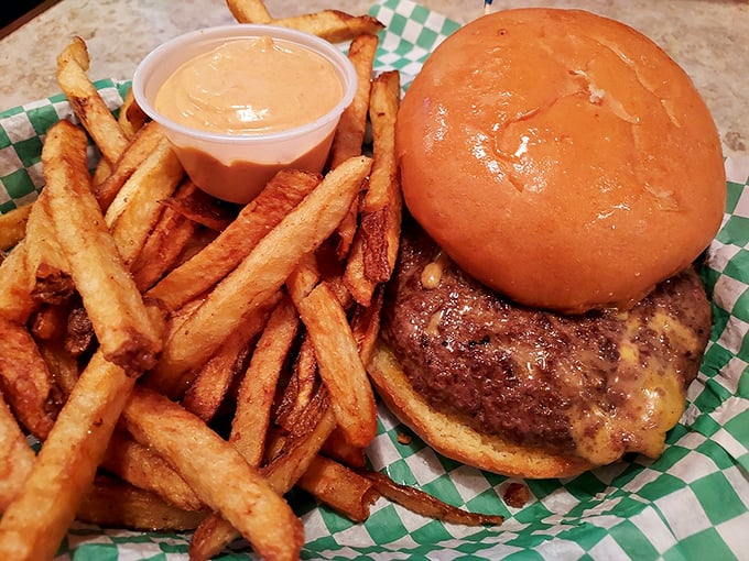 Behold, the Juicy Lucy in all its gooey glory! This burger doesn't just satisfy hunger - it performs magic tricks with melted cheese.