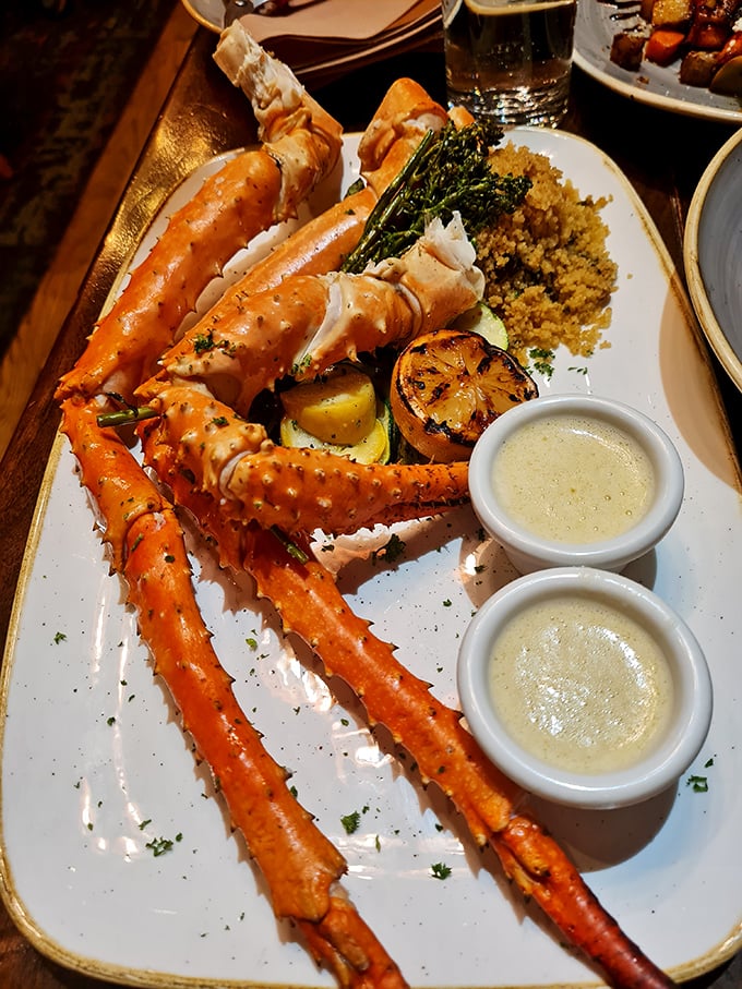 King crab legs fit for Poseidon himself! These ocean giants are served with lemony butter and grilled veggies &ndash; a feast that would make even mermaids jealous.
