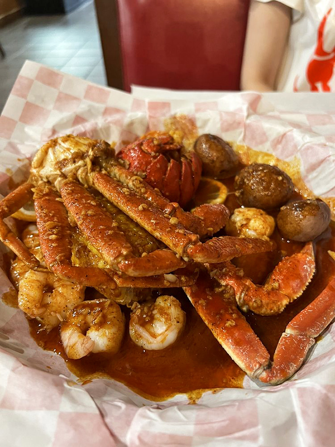 The holy trinity of seafood! This platter of lobster tail, snow crab legs, and shrimp is like a greatest hits album for your taste buds.