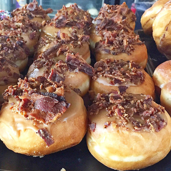 Bacon lovers, rejoice! These maple bacon beauties are what happens when breakfast decides to live its best life as a donut.