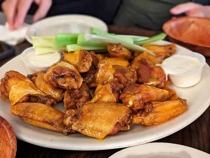 These aren't just wings; they're edible history. Crispy, saucy perfection served with the traditional celery sticks and cooling blue cheese.