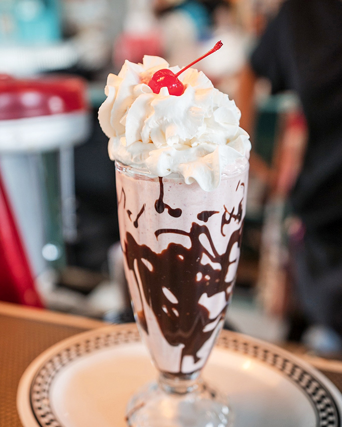 Holy moly, that's not a milkshake&mdash;it's a work of art! Topped with a mountain of whipped cream and a cherry, this chocolatey masterpiece is what dreams are made of.