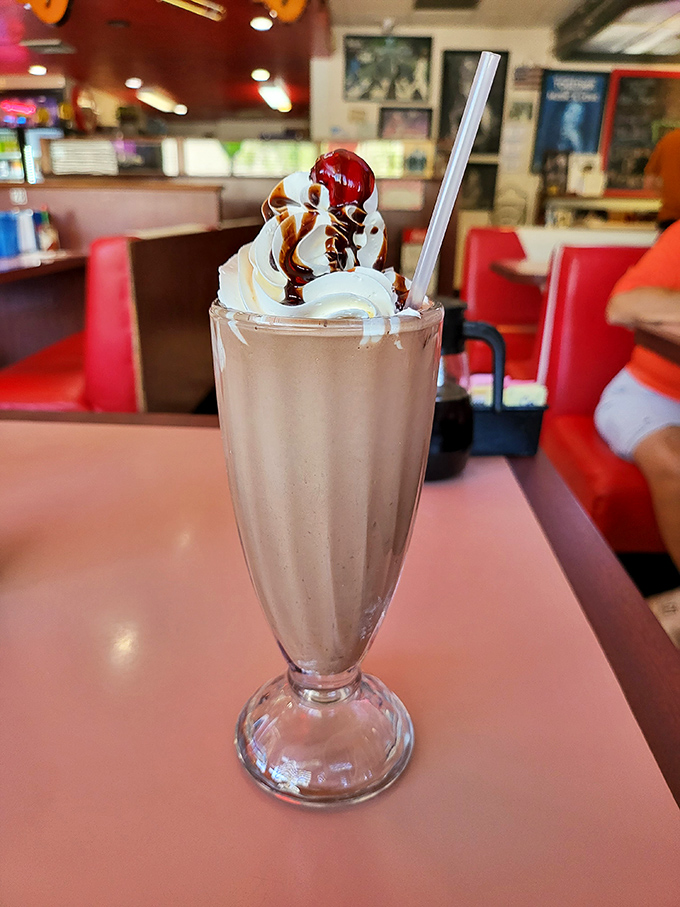 Holy moly, would you look at that shake! Topped with a cherry so perfect it could star in its own '50s musical, this creamy dream is ready for its close-up.