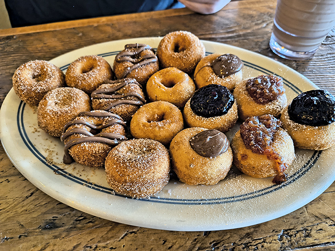 Tiny donuts, enormous flavor! These little circles of joy are like edible happiness, served warm and fresh. Size isn't everything, folks.