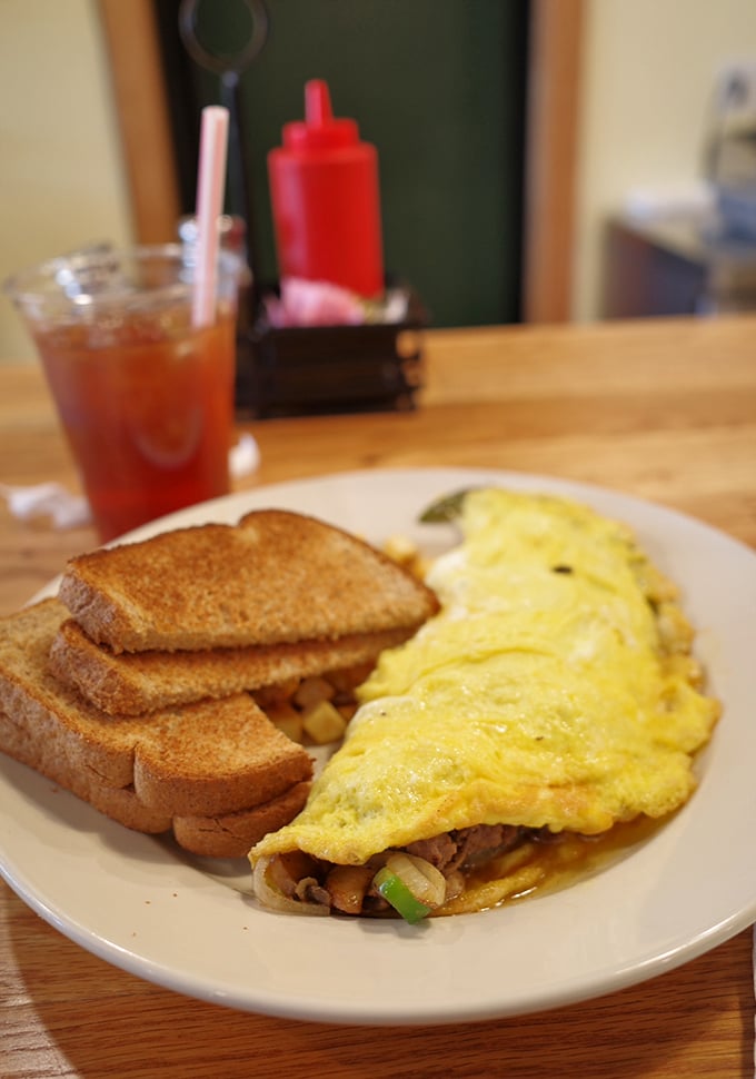 This omelet doesn't need to show off on social media; it's too busy being exactly what an omelet should be&mdash;fluffy, filled with goodness, and flanked by perfectly toasted bread.