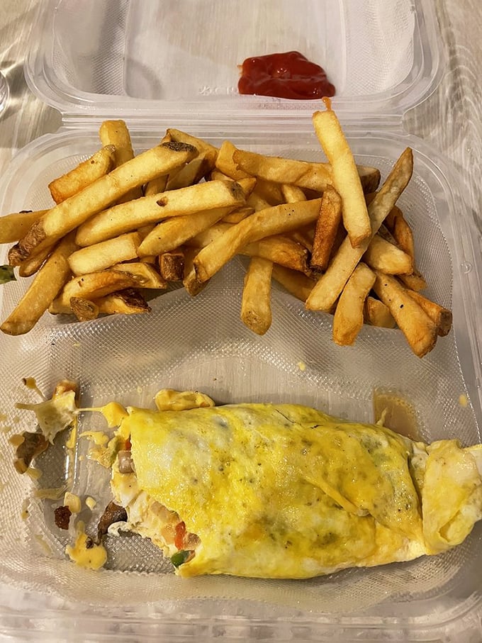 Behold, the holy grail of diner fare! This omelet and fries combo is the stuff of late-night dreams.