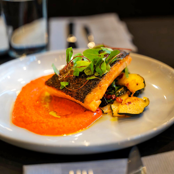 Salmon so perfectly seared, it could make a grizzly bear jealous. Paired with vibrant veggies, it's a plate that screams "I'm not in Utah anymore!"