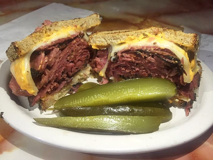 The Pastrami Reuben: where dreams and deli meats collide! This sandwich is stacked higher than a New York skyscraper.