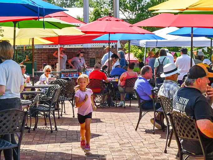 Looks like the locals have found the secret to Southern living – good company, colorful umbrellas, and a dash of sunshine.