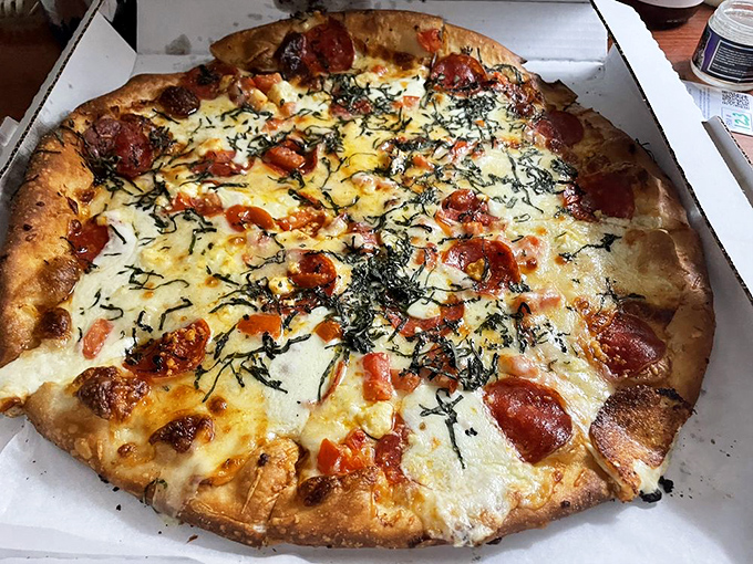 Behold, the pizza of your dreams! Golden crust, gooey cheese, and pepperoni that could make a vegetarian reconsider.