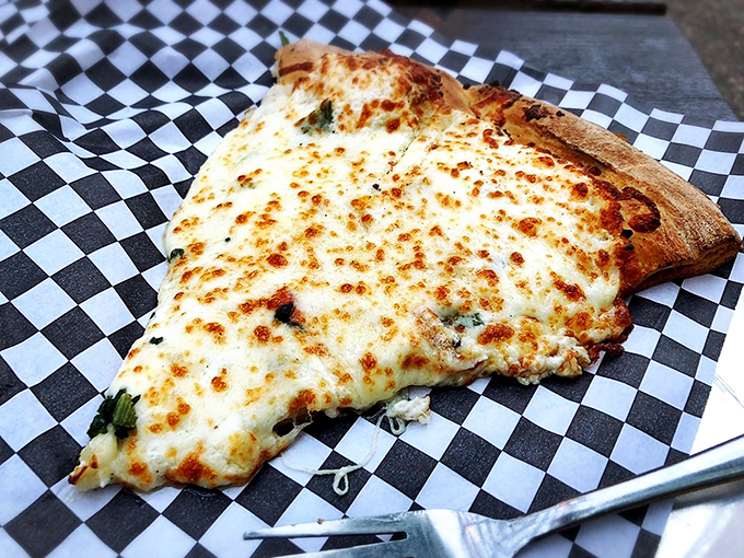 White pizza perfection! This Pizza Bianco is so creamy and garlicky, it could make a vampire reconsider their life choices.