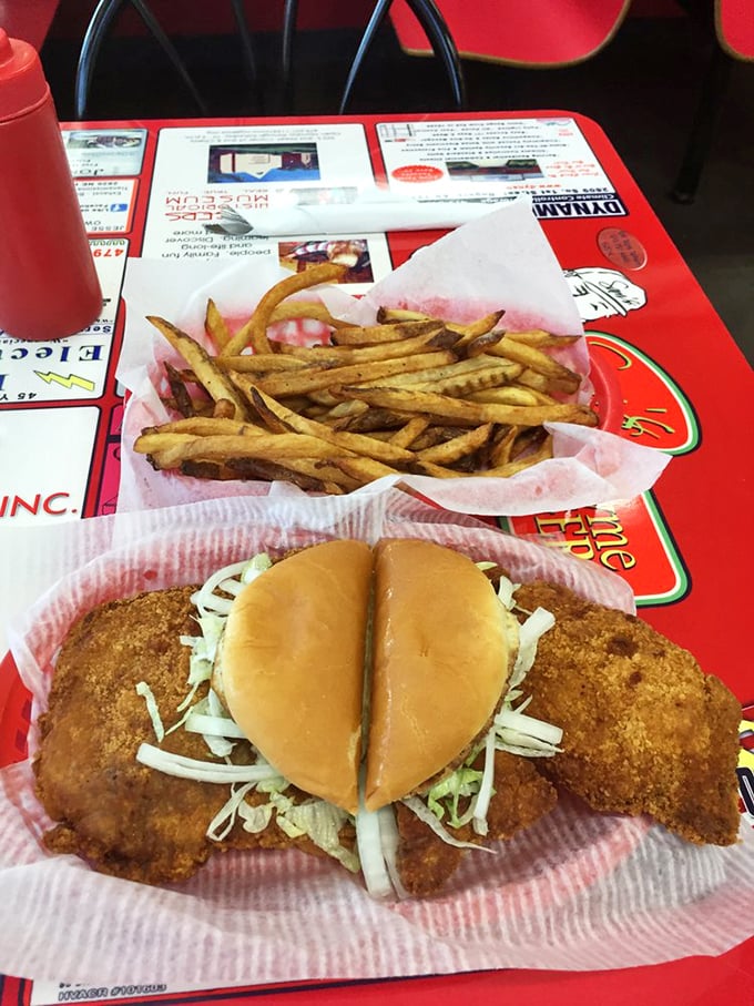 The star attraction in all its glory&mdash;a pork tenderloin that refuses to acknowledge bun boundaries, served with perfectly golden fries.