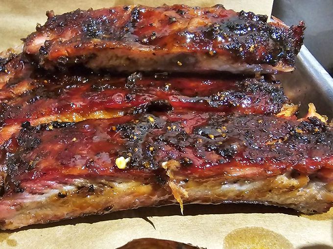 Behold, the pork rib in all its glistening glory! These bad boys look so good, they might just make vegetarians reconsider their life choices.