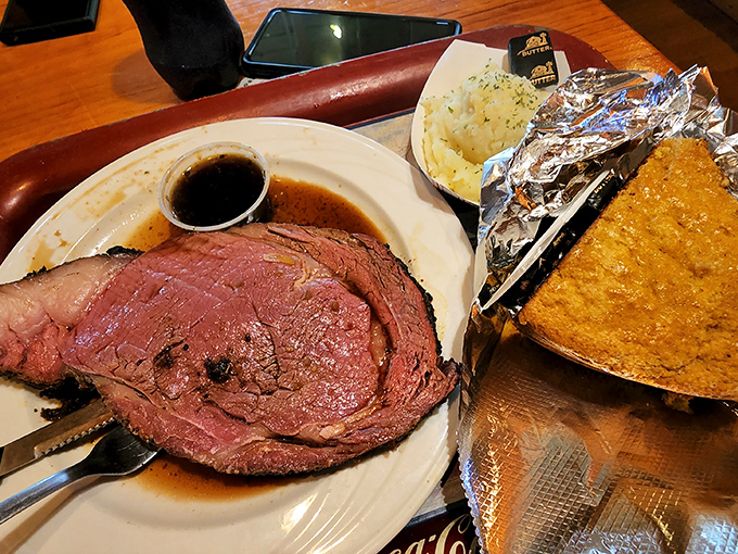Behold the prime rib, a carnivore's dream come true! Paired with golden cornbread, it's a match made in comfort food heaven.