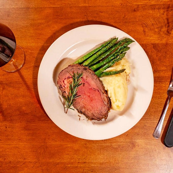Behold, the crown jewel of carnivores! This prime rib is so perfectly cooked, it could make a vegetarian question their life choices.