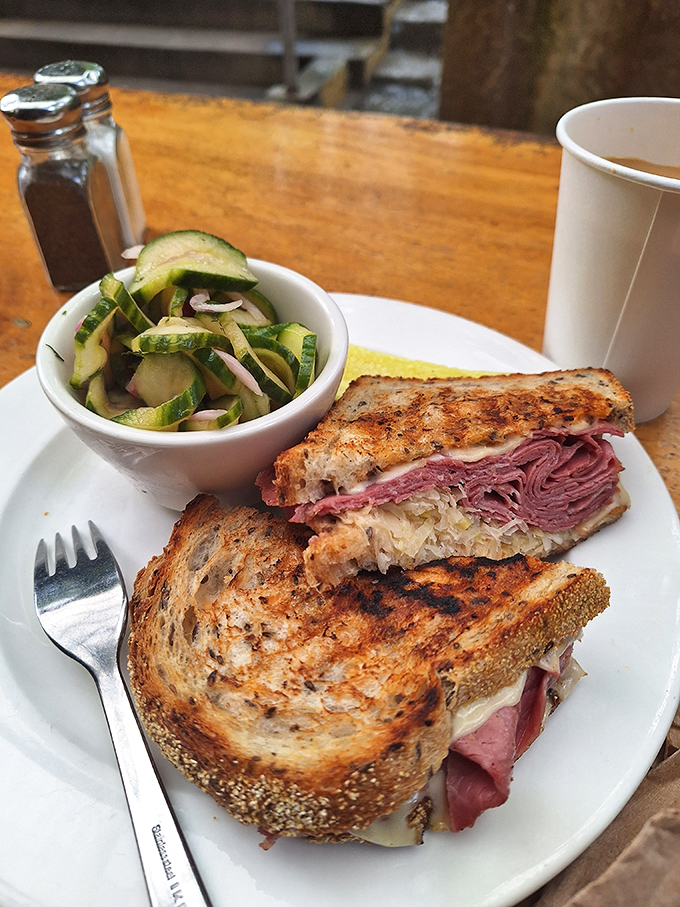 The Reuben that launched a thousand food pilgrimages. This sandwich is stacked higher than a Jenga tower and twice as satisfying when it topples into your mouth.