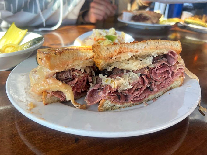 Behold, the Reuben in all its glory! Layers of corned beef and sauerkraut nestled between grilled rye &ndash; it's a sandwich that demands respect.