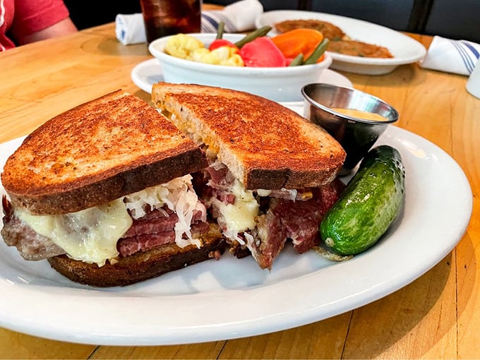 Holy moly, it's the Colossus of Reubens! This sandwich isn't just a meal, it's a skyscraper of savory satisfaction.