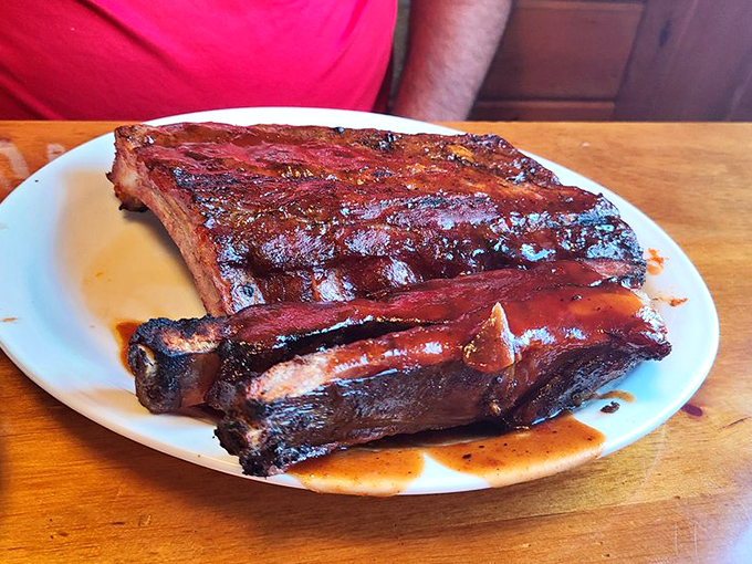 Holy smoke rings, Batman! These ribs aren't just fall-off-the-bone tender; they're practically levitating off the plate. Gravity-defying deliciousness!
