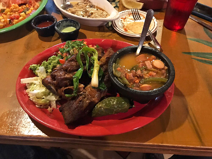 Holy mole, Batman! This rib platter isn't just a meal; it's a carnivore's carnival, complete with a side of veggie confetti.